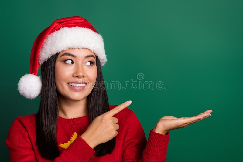 Photo Of Young Dreaming Vietnamese Cute Woman Wear Santa Headwear Hold