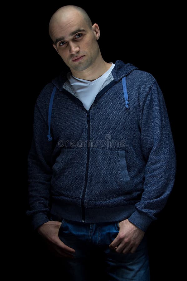 Young Hairless Man in Shadow with Arms Crossed Stock Photo - Image of ...