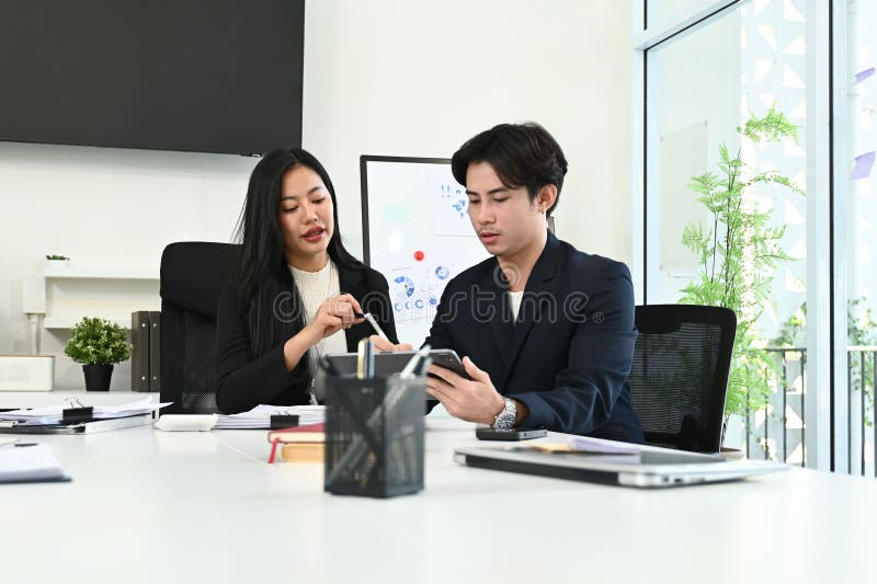 Photo of Young Office Workers Working Together at the Working Desk with ...