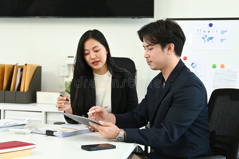 Photo of Young Office Workers Working Together at the Working Desk with ...