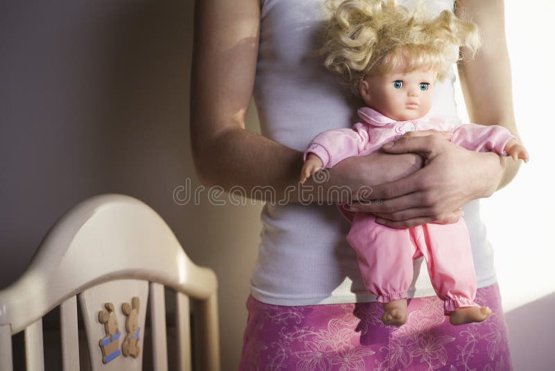 Photo of Young Woman Holding Doll Stock Image - Image of face ... Photo of Young Woman Holding Doll Stock Image - Image of face ...