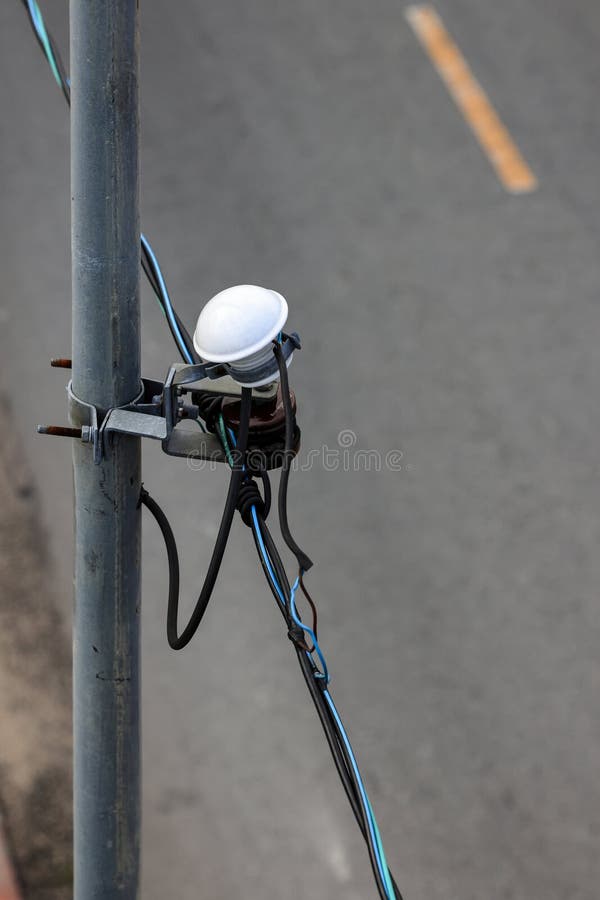 Photoelectric Sensor Switch Installed on an Public Electric Pole ...