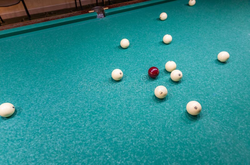 A Photograph of a Pool or Billiards Table in an Interestingly Lit Bar ...