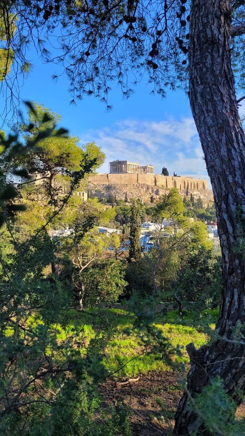 The Photograph Shows a View of the Acropolis of Athens through the ...