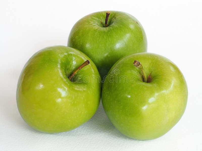 Photograph of Three Green Apples Stock Photo - Image of light, details ...