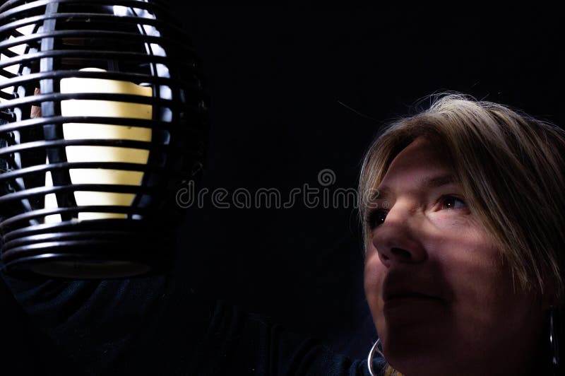 Photograph of a Woman with a Light in Her Hand that Makes Shadows on ...