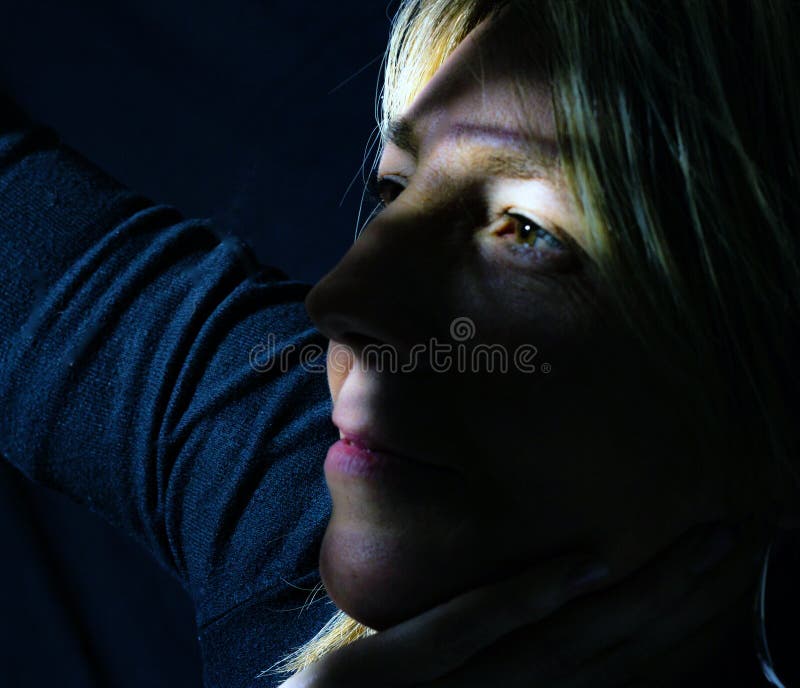 Photograph of a Woman with a Light in Her Hand that Makes Shadows on ...
