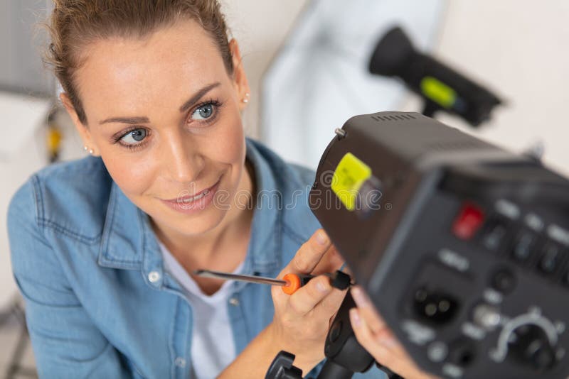 Photographer Adjusts Flash Light on Studio Stock Photo - Image of lens ...