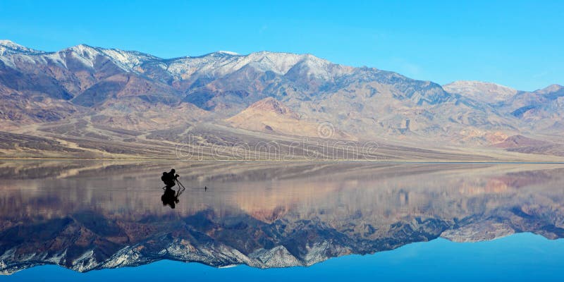 Photographer on Bad water. stock image. Image of rocks - 15488995