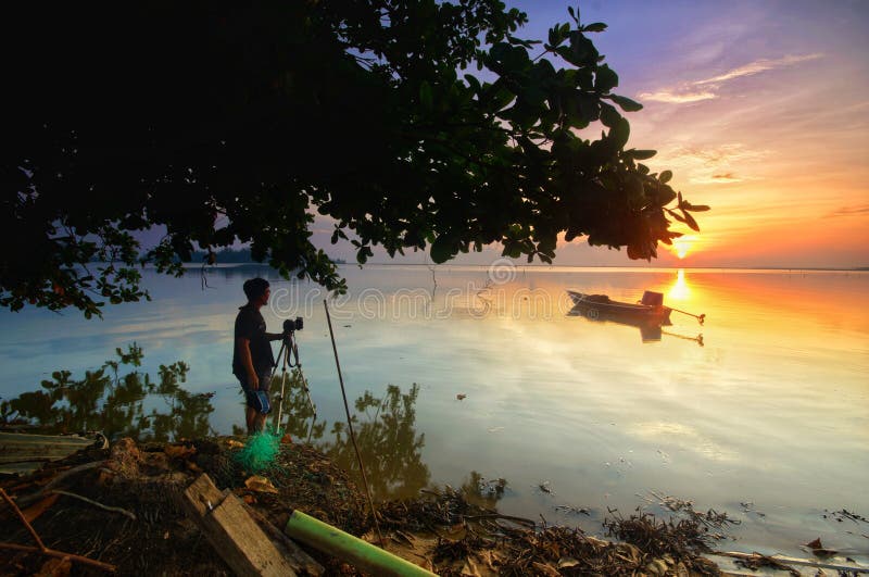 Photographer and Boat during Sunrise Editorial Image - Image of sunrise ...