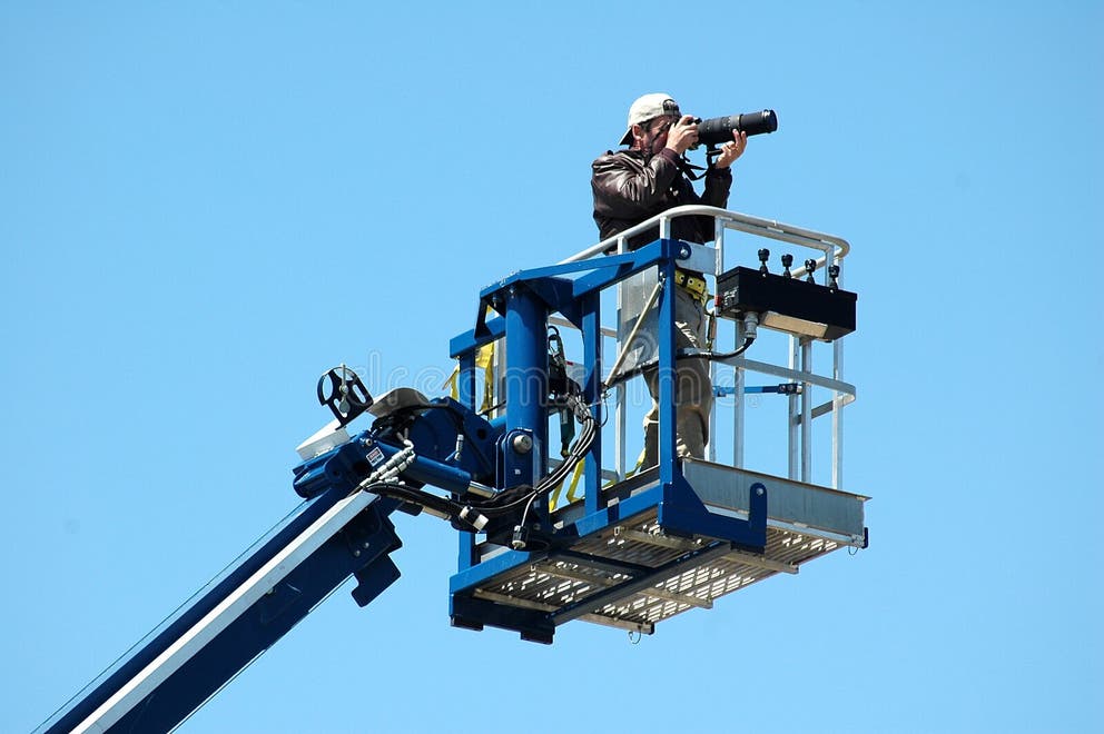 Photographer on a Boom Dock Stock Photo - Image of digital, camera: 860864