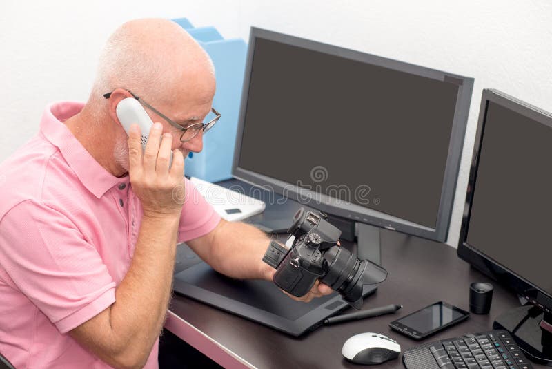 Photographer with Camera at Office with Computer Stock Image - Image of ...