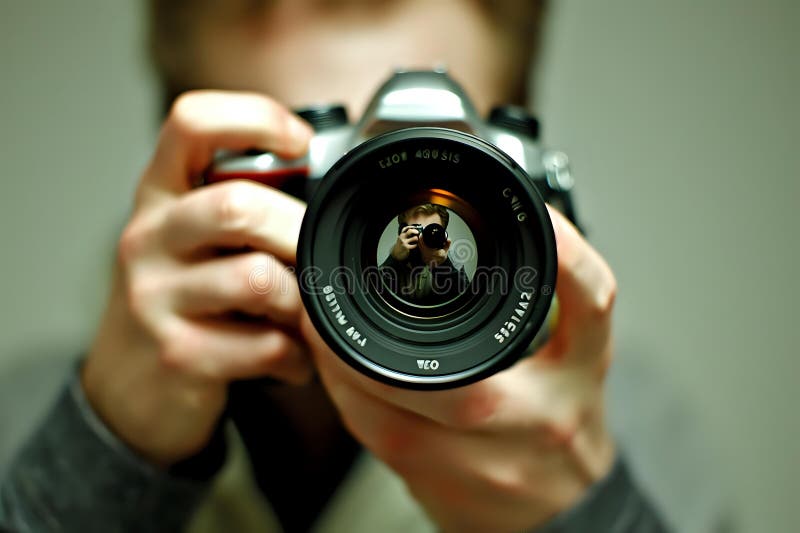 A Photographer Captures a Self-Portrait Reflecting in the Lens ...