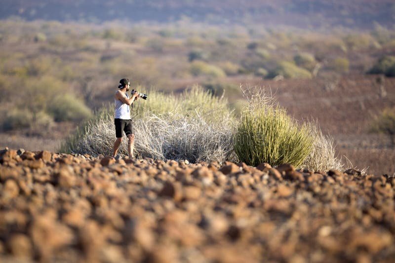 Photographer Chasing a Shot Editorial Stock Image - Image of chasing ...