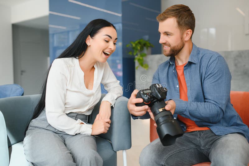 Photographer Communicates with the Client in the Office. Stock Photo ...