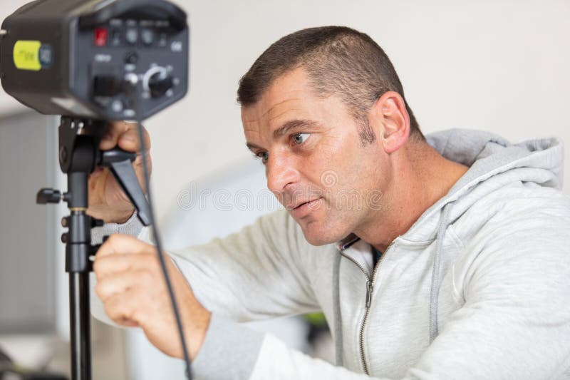 Photographer Controlling Studio Flash Strobe Lighting Head Stock Image ...