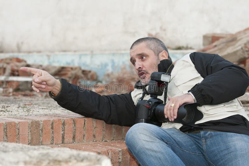 Photographer in a Dangerous Situation. Stock Photo - Image of hold ...