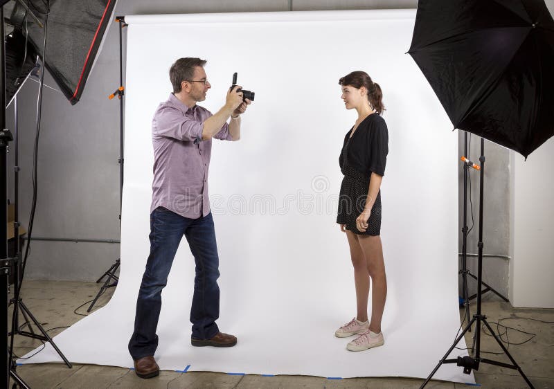 Photographer Demonstrating Studio Photography Stock Photo - Image of ...
