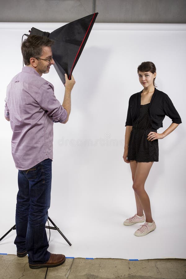 Photographer Demonstrating Studio Photography Stock Photo - Image of ...