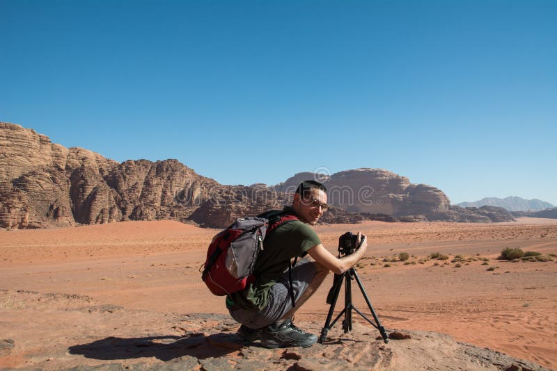 Photographer in the desert stock image. Image of landscape - 57629639