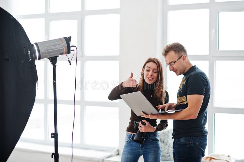Photographer Explaining about the Shot To His Assistant in the Studio ...