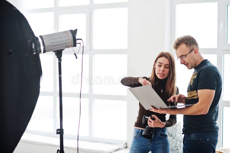 Photographer Explaining about the Shot To His Assistant in the Studio ...