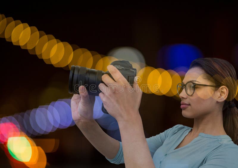 Photographer in Front of Lights Bokeh Stock Image - Image of holding ...