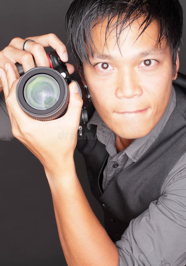 Photographer Holding a Camera Stock Photo - Image of skinny, male: 22124866