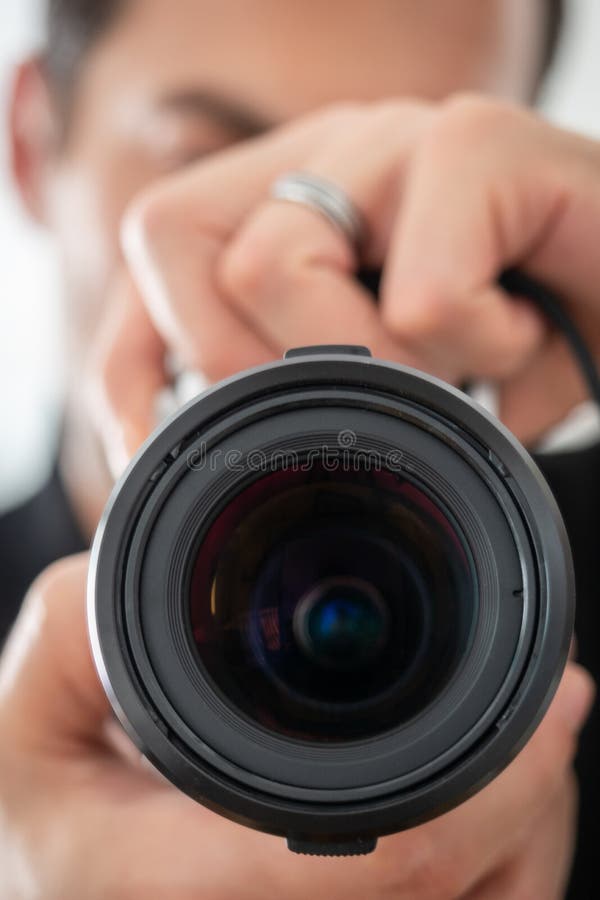 Photographer Holding a Camera Stock Image - Image of close, isolated ...