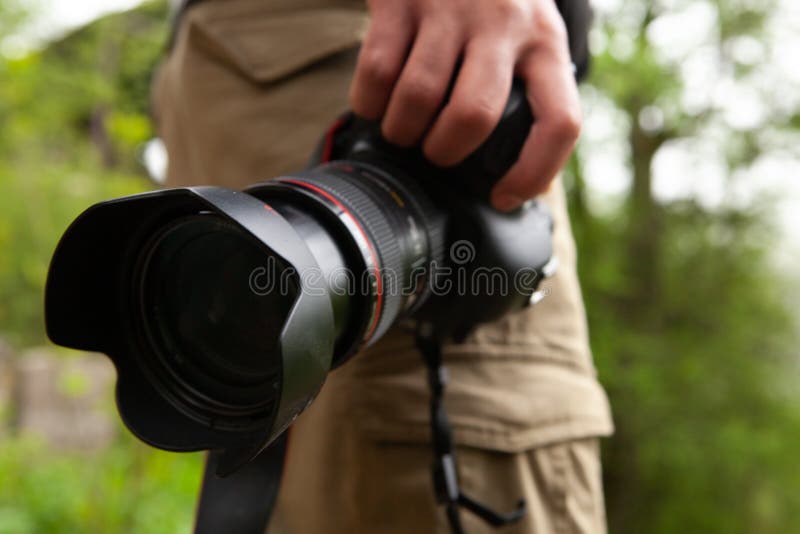 Photographer Holding a Camera in His Hand Stock Photo - Image of nature ...