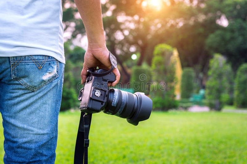 Photographer Holding Camera. Stock Image - Image of city, occupation ...