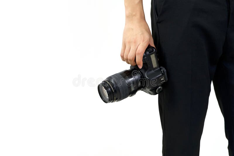 The Photographer Holds the Camera by Hand in the Hip Position Stock ...