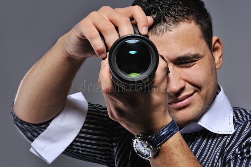 Photographer making a shot stock image. Image of equipment - 13316415