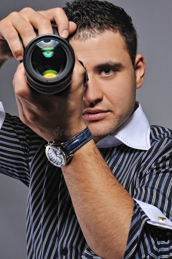 Photographer making a shot stock image. Image of optical - 13316453