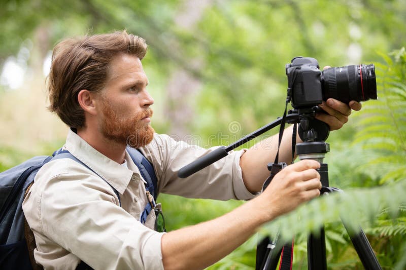 Photographer Man with Professional Camera on Tripod Shooting Wildlife ...