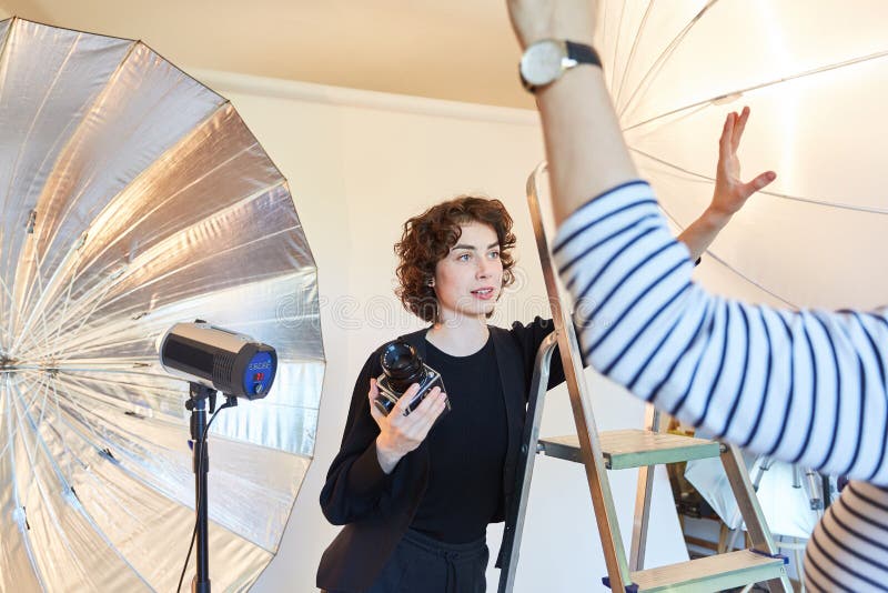 Photographer with Medium Format Camera in Front of the Flash Unit Stock ...