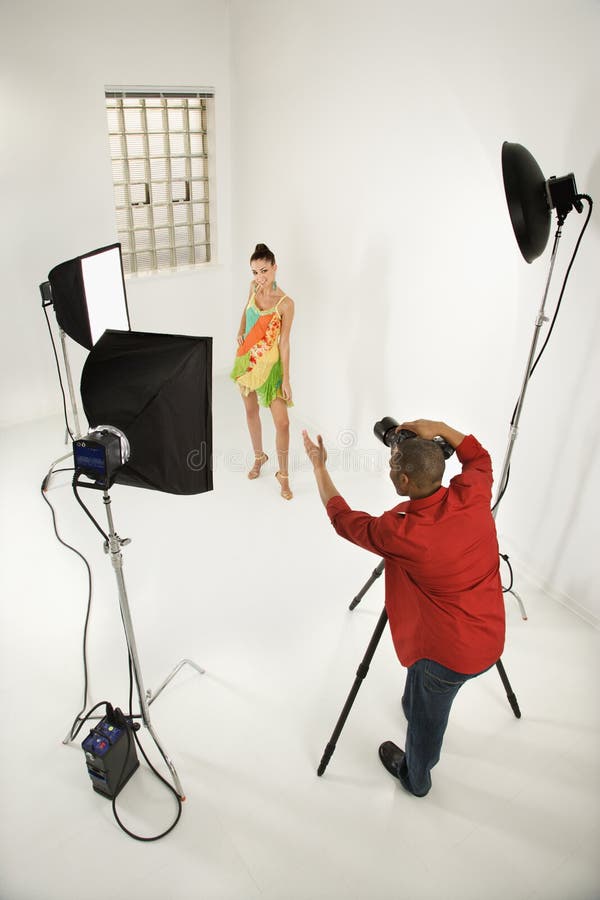 Photographer with a model. stock image. Image of vertical - 2044453