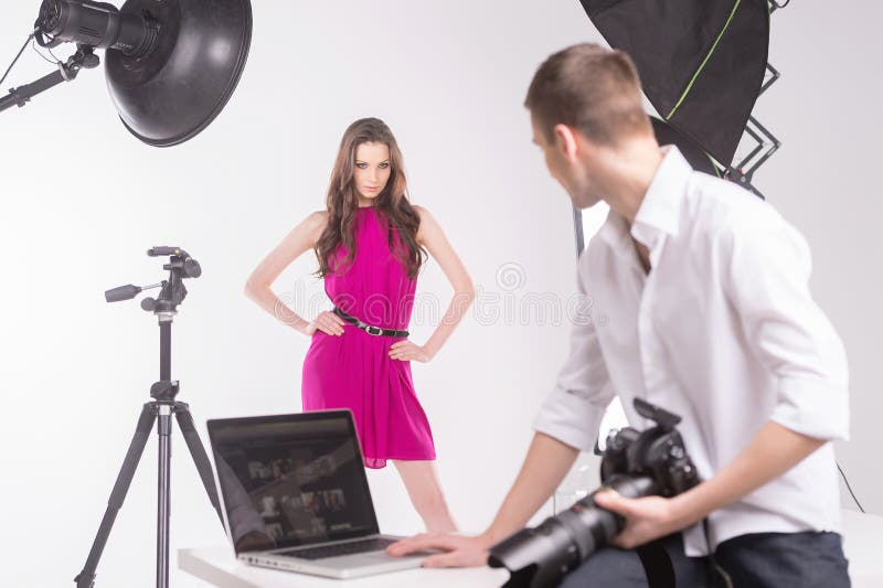 Photographer with a model. stock photo. Image of profession - 2044448