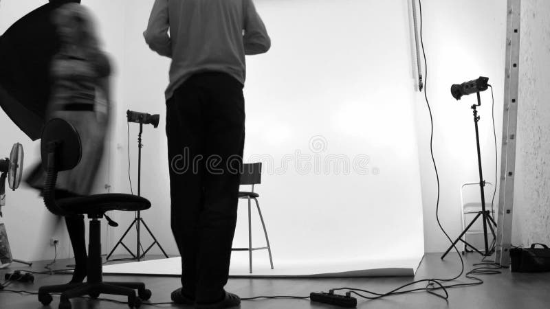 Photographer and Model in Studio. in Black and Stock Footage - Video of ...