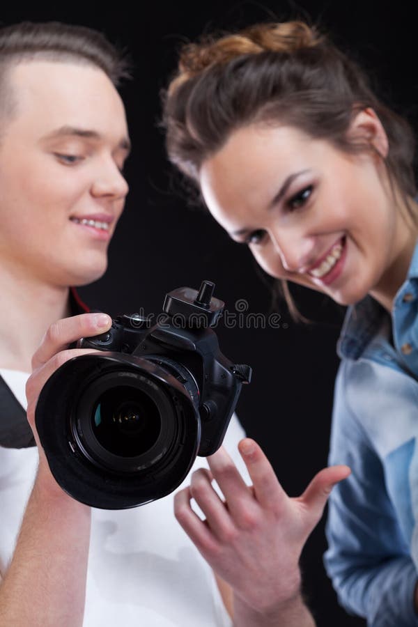 Photographer and Model Watching Effects of Their Work Stock Image ...