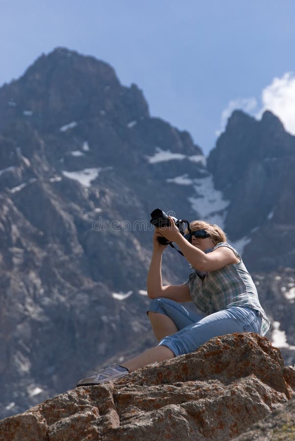 Photographer in mountain stock image. Image of hike, exploration - 12574327