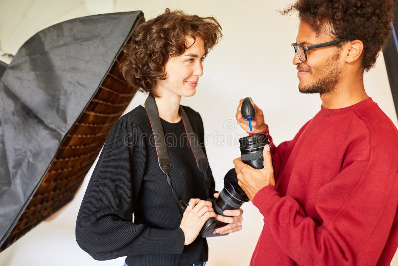 Photographer and Photo Assistant Clean Camera Lens Stock Image - Image ...