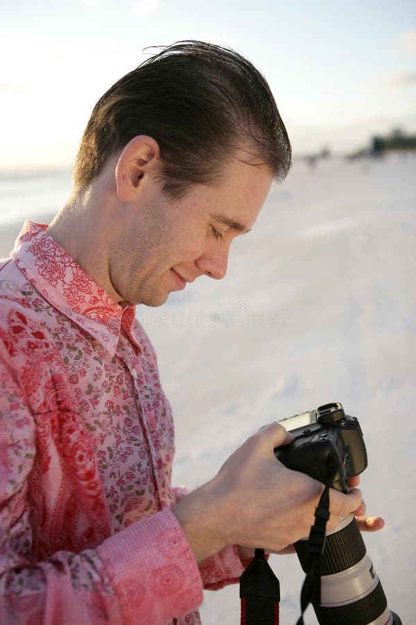 Photographer Reviewing Photos Stock Photo - Image of beard, digital ...