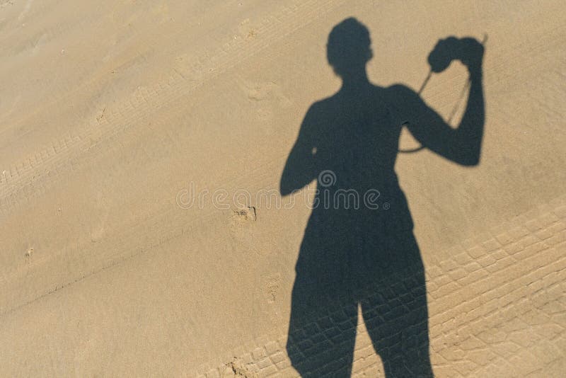 Photographer`s Shadow on the Sand. Yound Man Doing the Photo of His ...