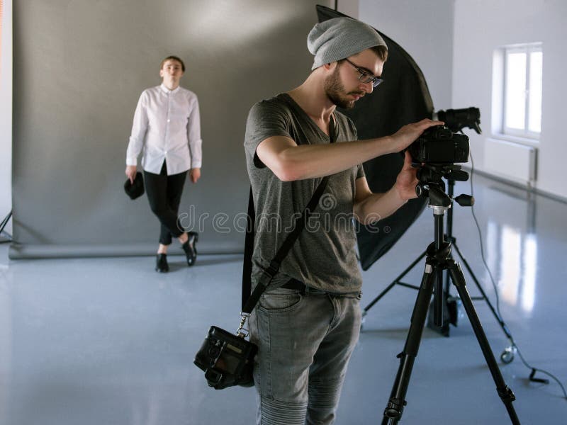 Photographer Setting Camera during Session Stock Photo - Image of ...