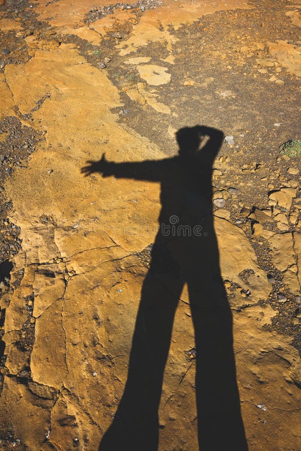 Photographer Shadow with Rock Background Stock Image - Image of rock ...