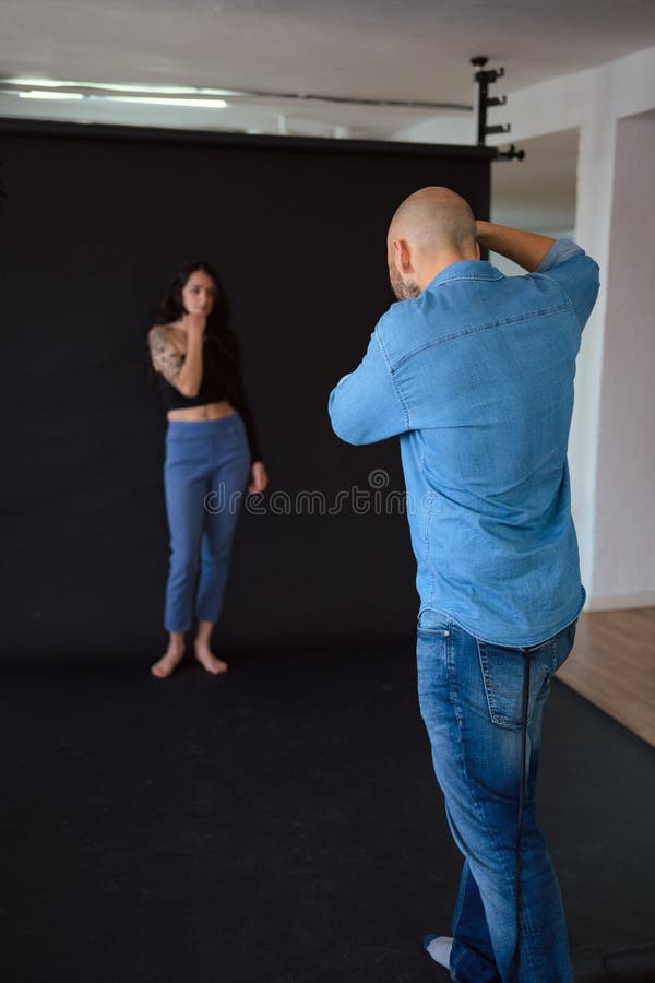 Photographer Shooting a Model in a Studio with a Softbox Stock Photo ...