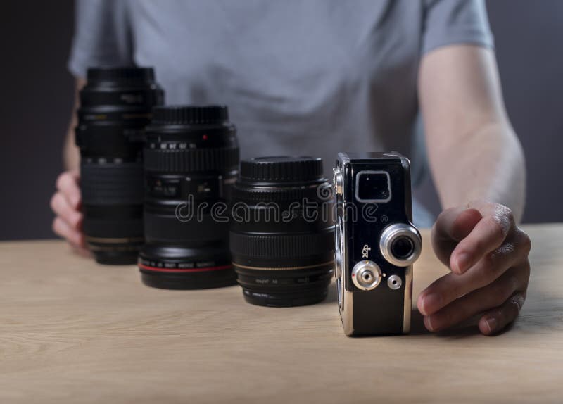 Photographer Showing Camera Development from Vintage Old One To ...