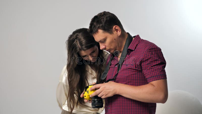 Photographer Shows Models Captured Frames on Camera Display ...