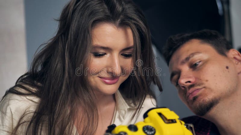 Photographer Shows Models Captured Frames on Camera Display ...